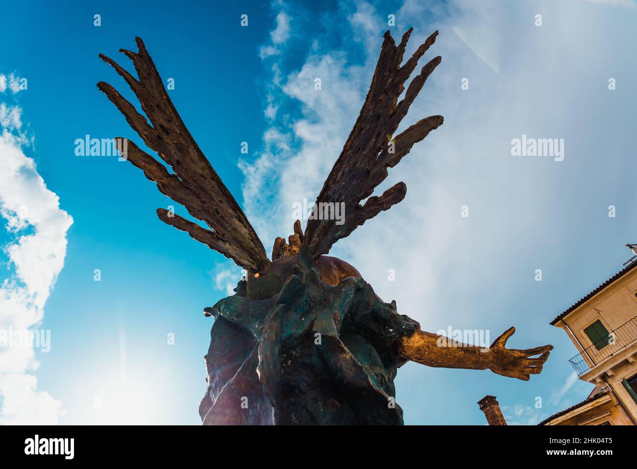 A sculpture of an angel, rear view of its wings against the sky Stock ...