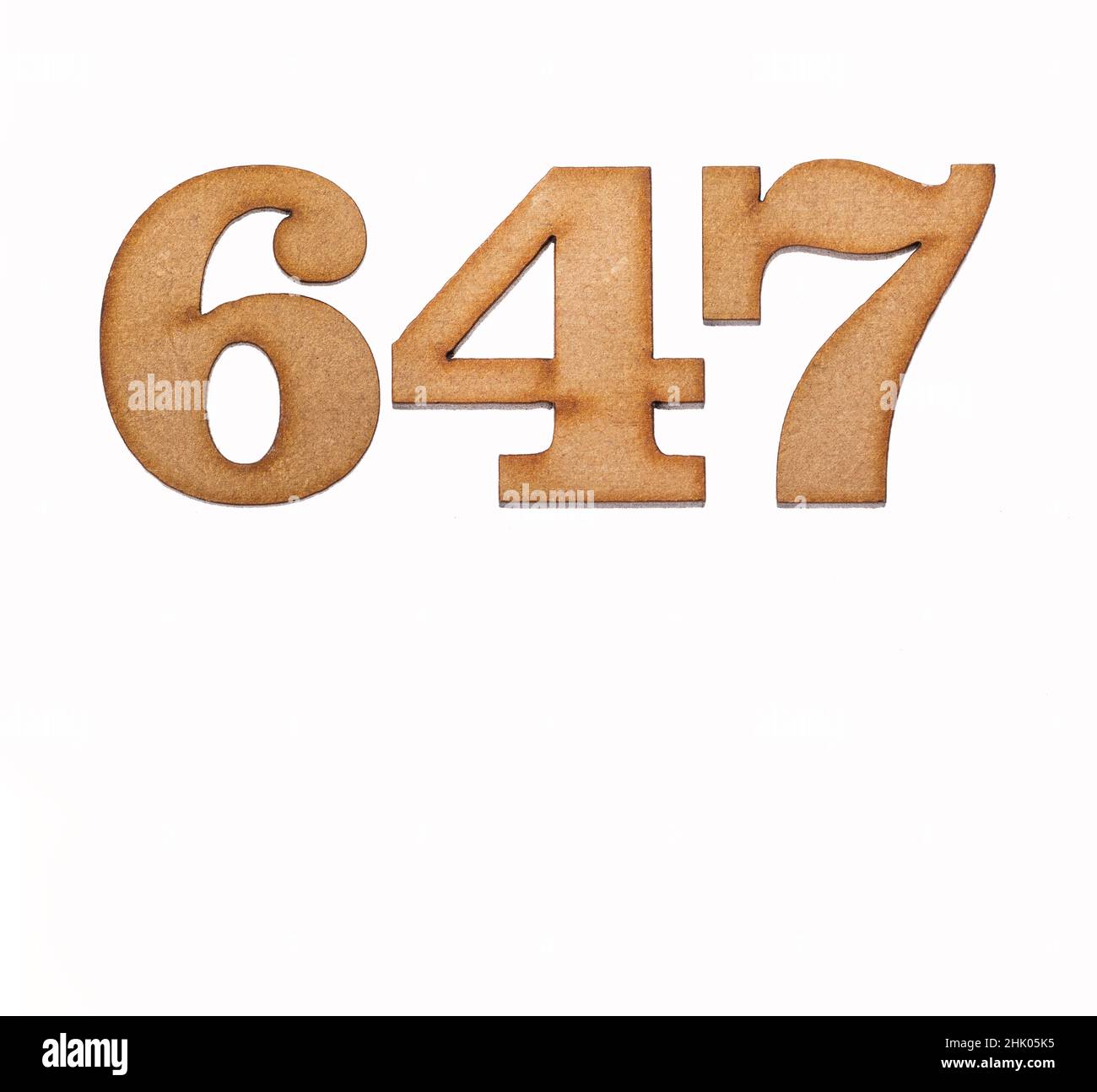 Number 647 in wood, isolated on white background Stock Photo - Alamy