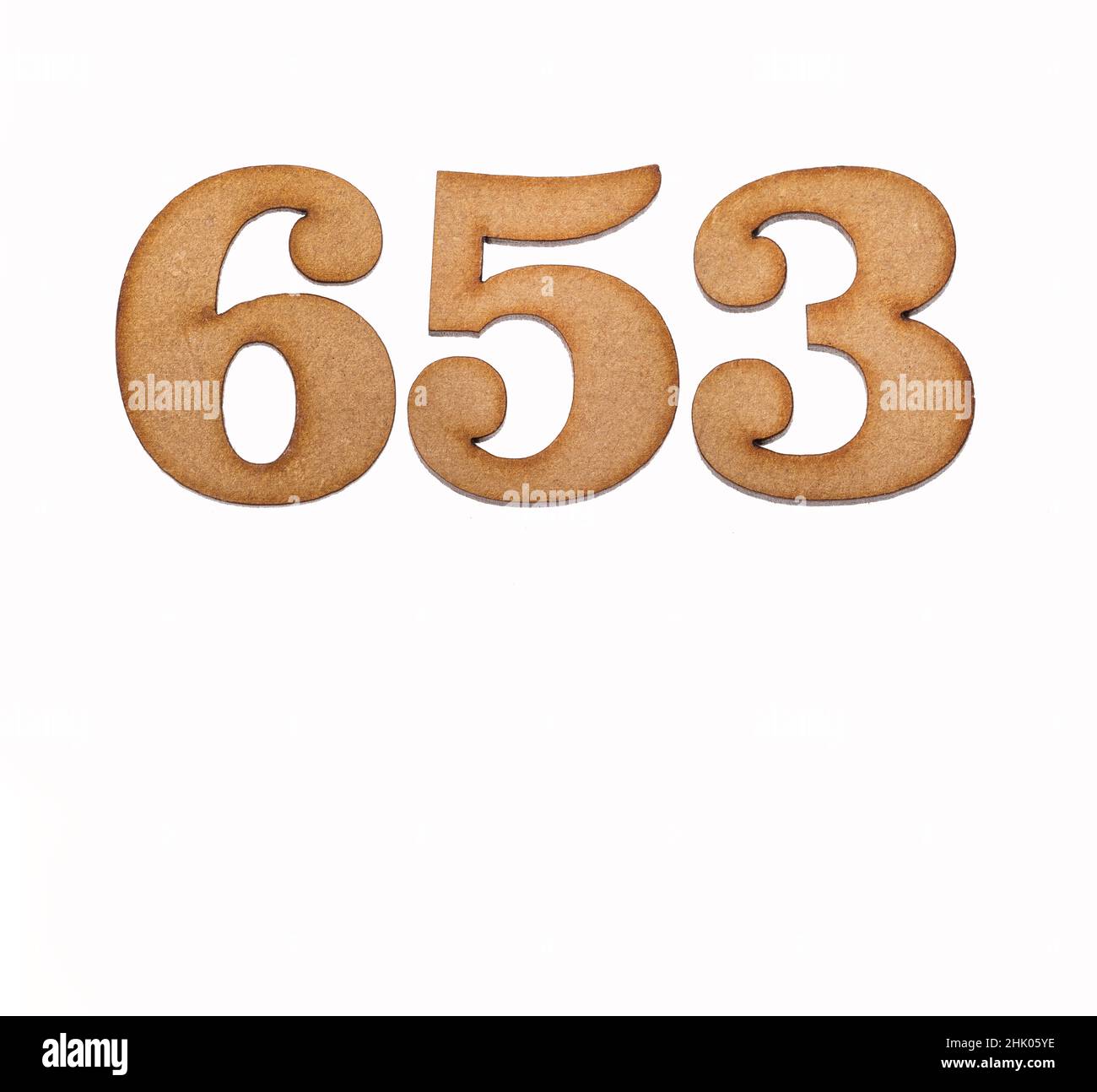 Number 653 in wood, isolated on white background Stock Photo - Alamy