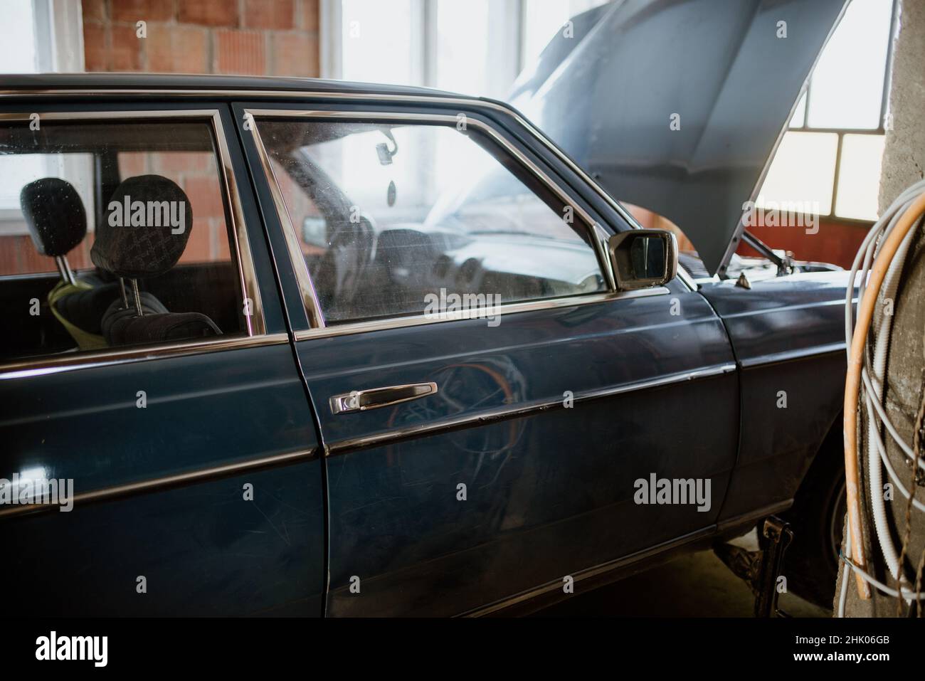 Old and broken car in the garage Stock Photo - Alamy
