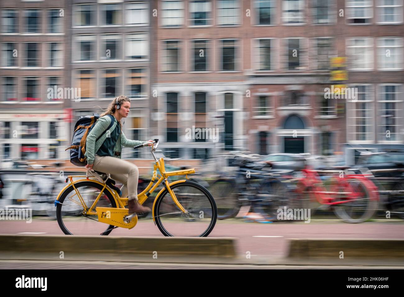 Young woman riding bicycle in Amsterdam Netherlands (Holland) Europe ...