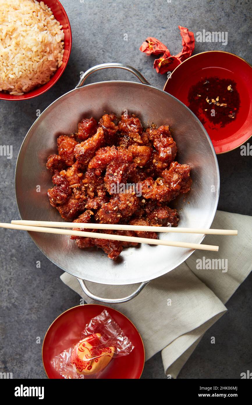 Orange Chicken in Wok with Rice Stock Photo - Alamy