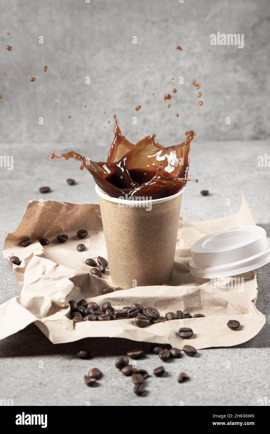 Coffee splash on light background. Vertical format Stock Photo - Alamy