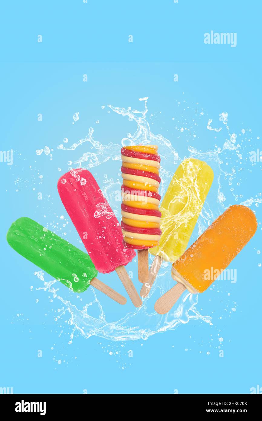 Colorful popsicles ice cream on blue background with splash vertical ...