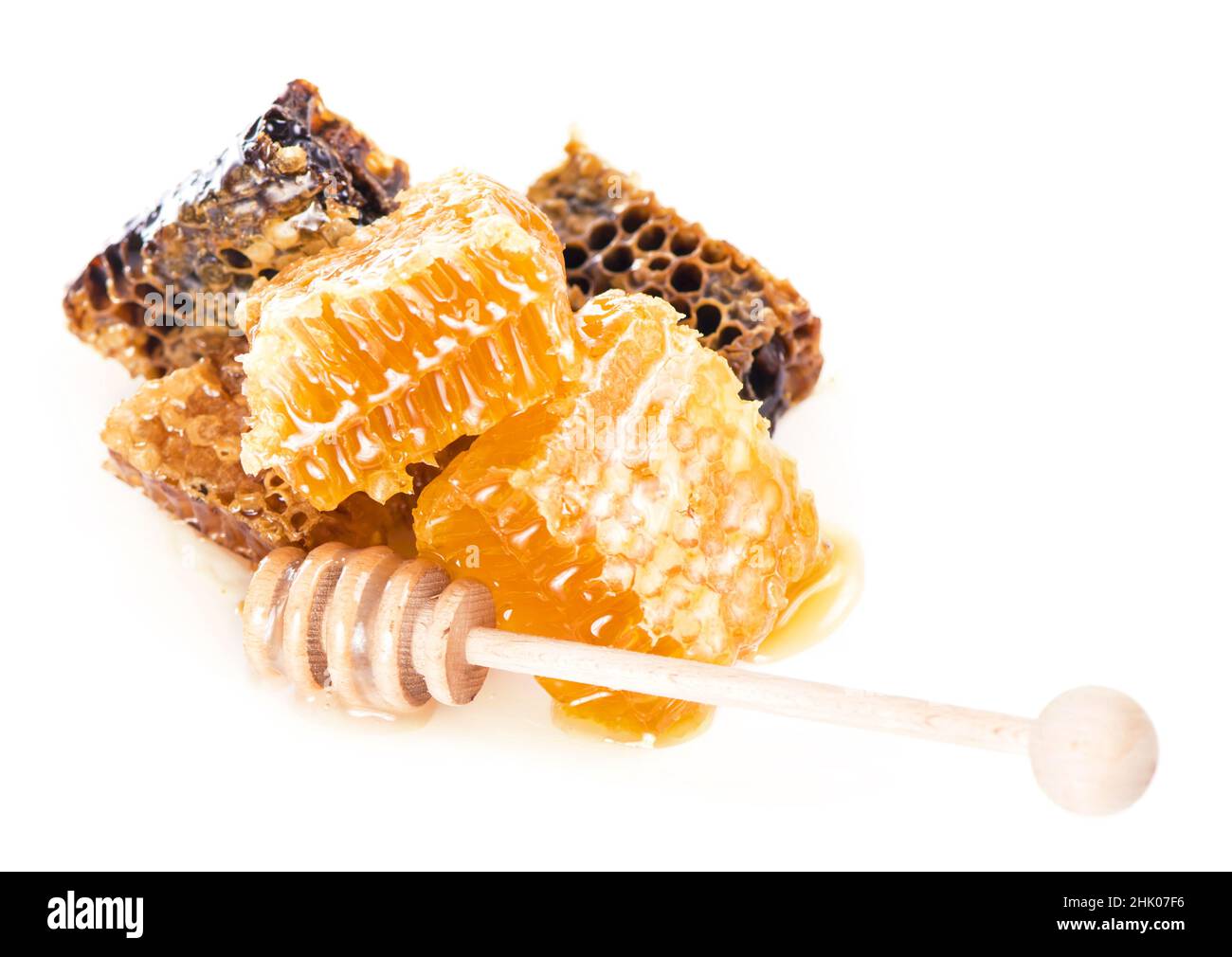 Honeycomb and honey dipper isolated on white background Stock Photo - Alamy