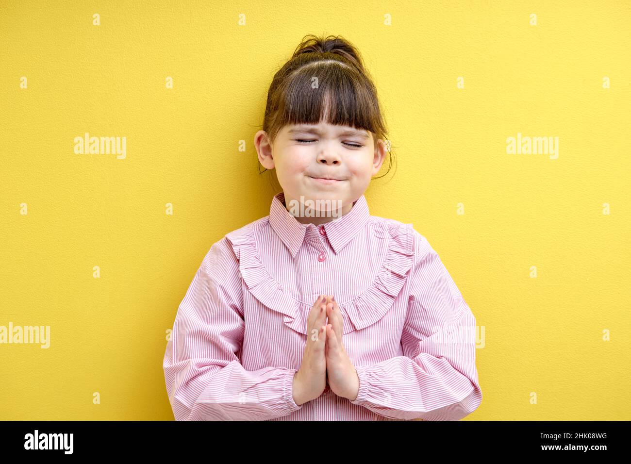 little girl begging to buy, ask something. sweet child in pink blouse ...