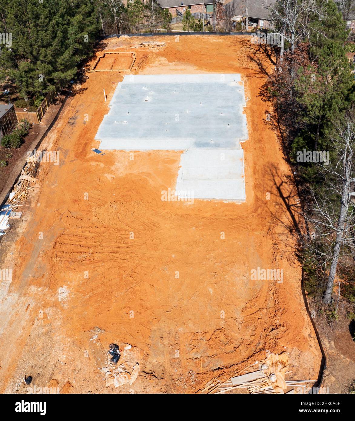 Concrete slab on a dirt lot for a new home Stock Photo - Alamy