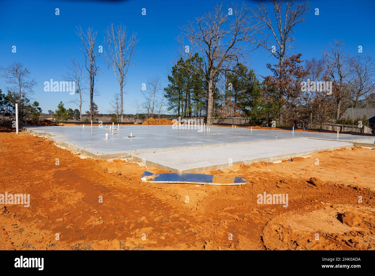 Concrete slab on a dirt lot for a new home Stock Photo - Alamy