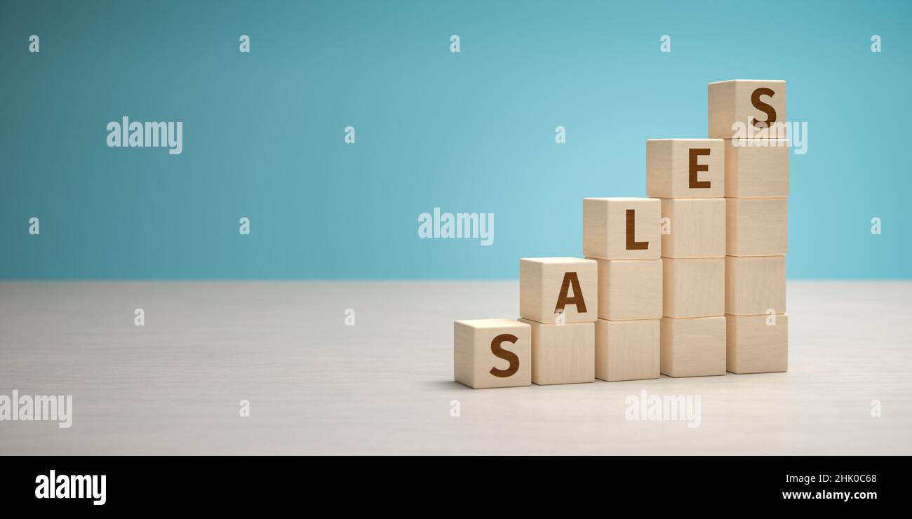 Wooden cubes piled onto each other in rising stacks. The word "sales ...