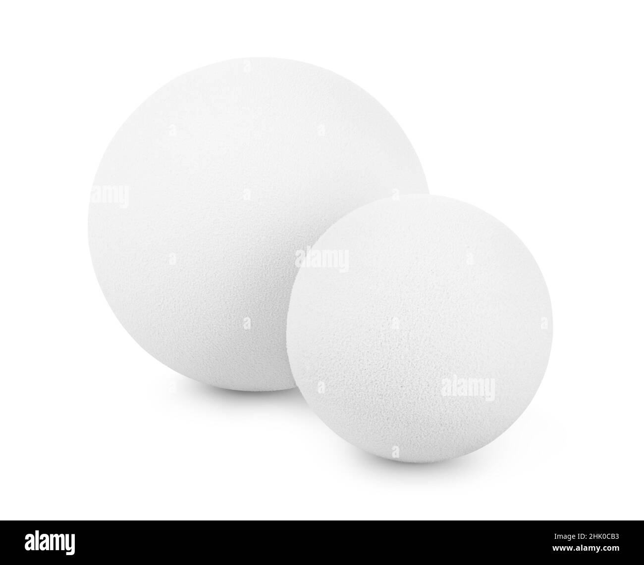 Two white spheres isolated on a white background Stock Photo - Alamy