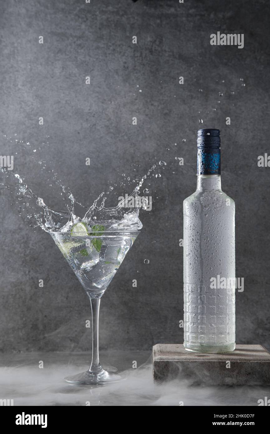 Vodka splash on dark background with copyspace. Vertical format Stock Photo - Alamy