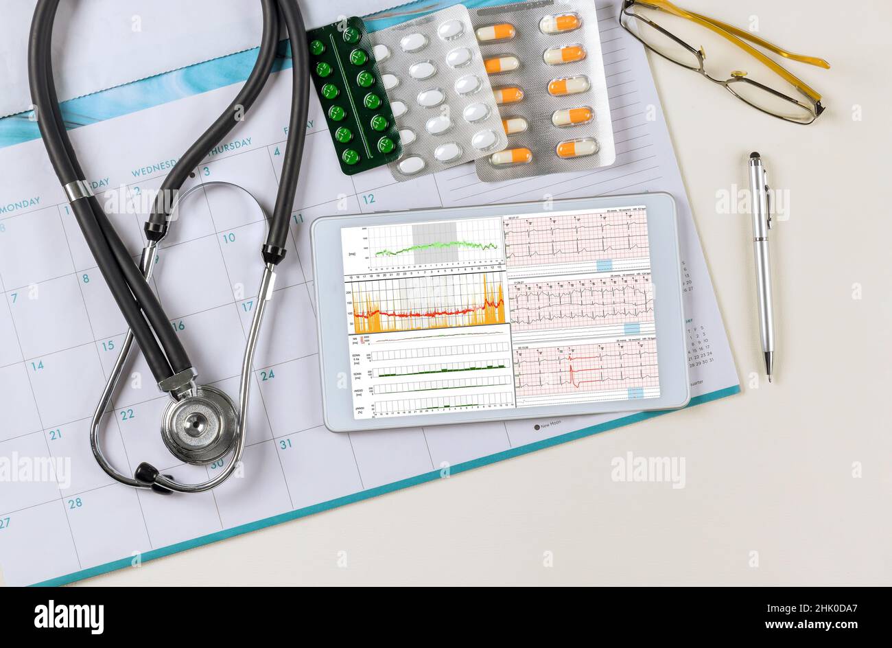 Medical examination with cardiologist reading electrocardiogram of ECG ...