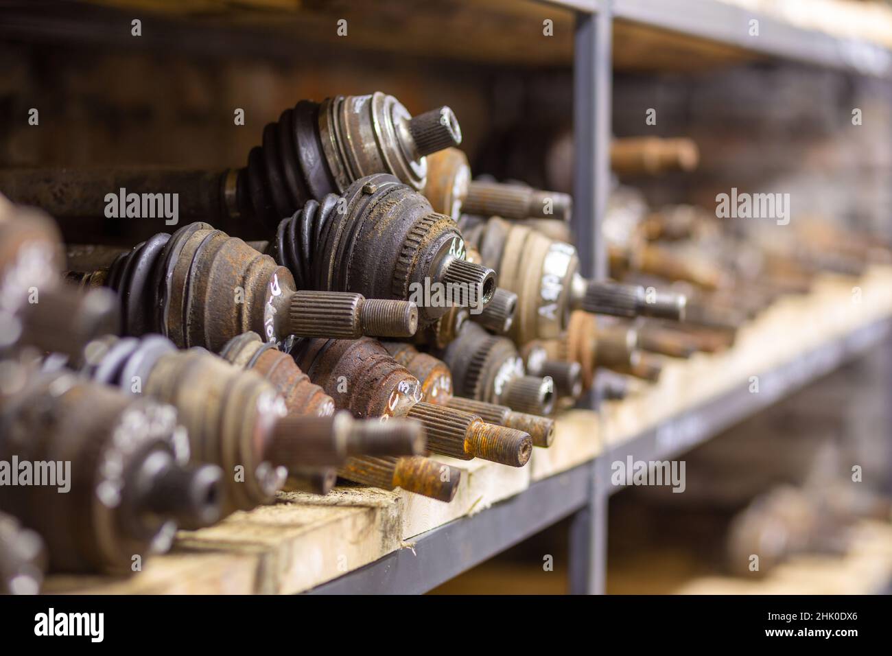 Used car parts on the factory shelf. Used auto parts for sale in a ...