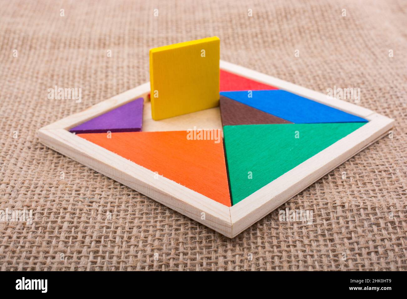 Colorful pieces of a square tangram puzzle Stock Photo - Alamy