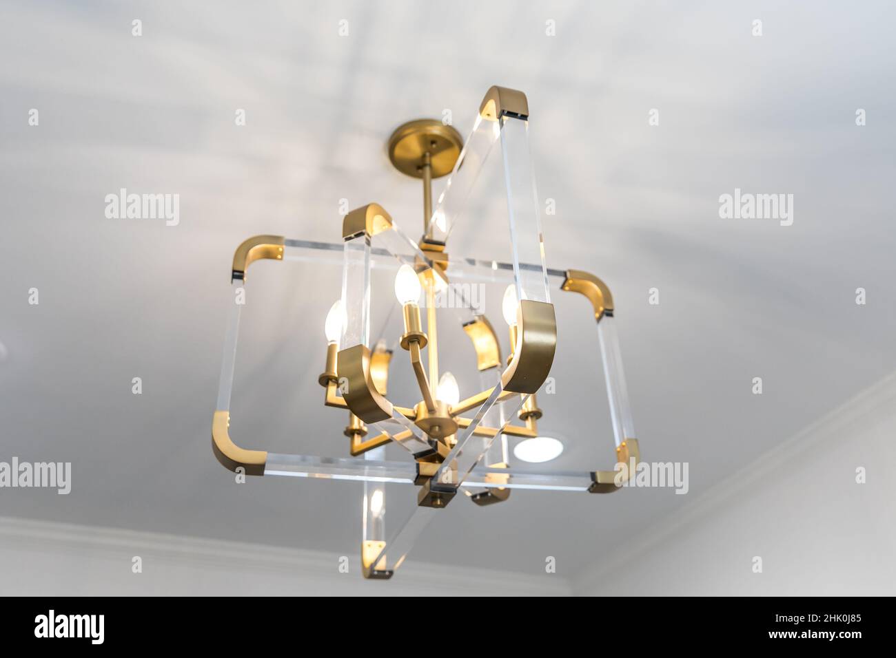 Retro acrylic and glass clear lighting fixture with warm brushed gold ...