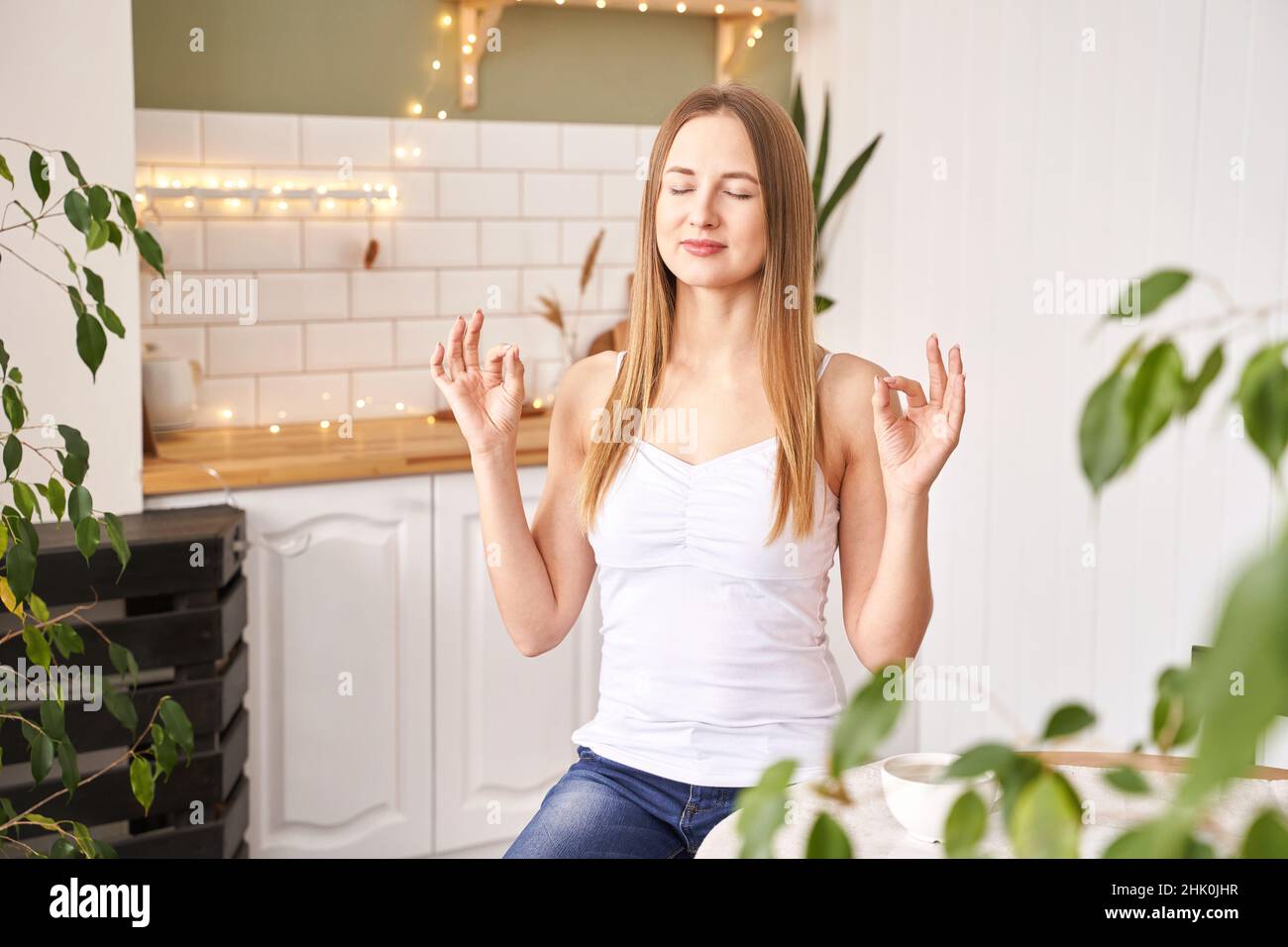 Young woman posing at kitchen. Home vacation portrait. Blogger. Alone ...