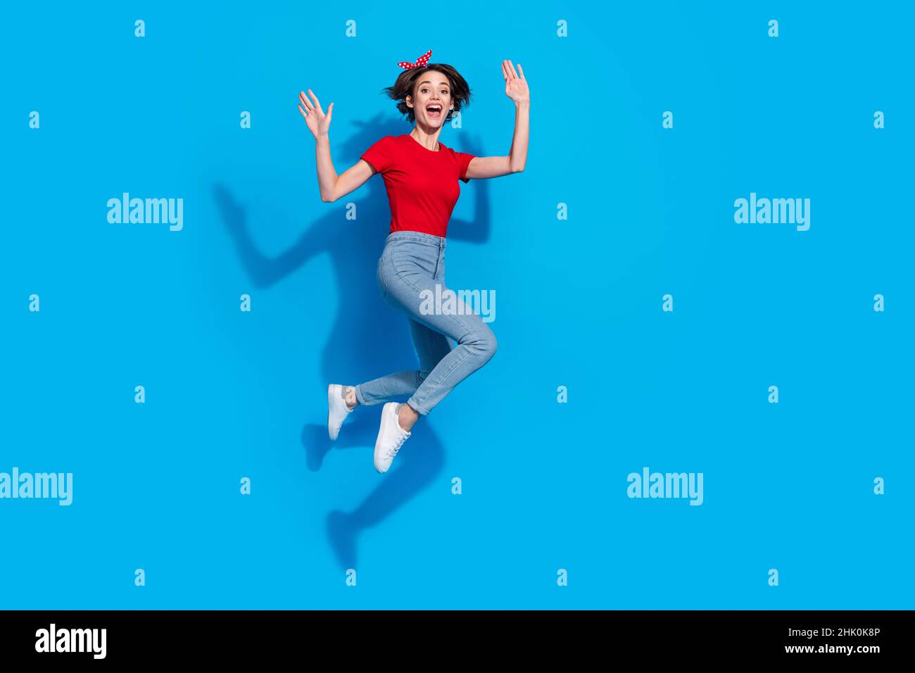 Full body profile side photo of young excited woman have fun jump wave ...