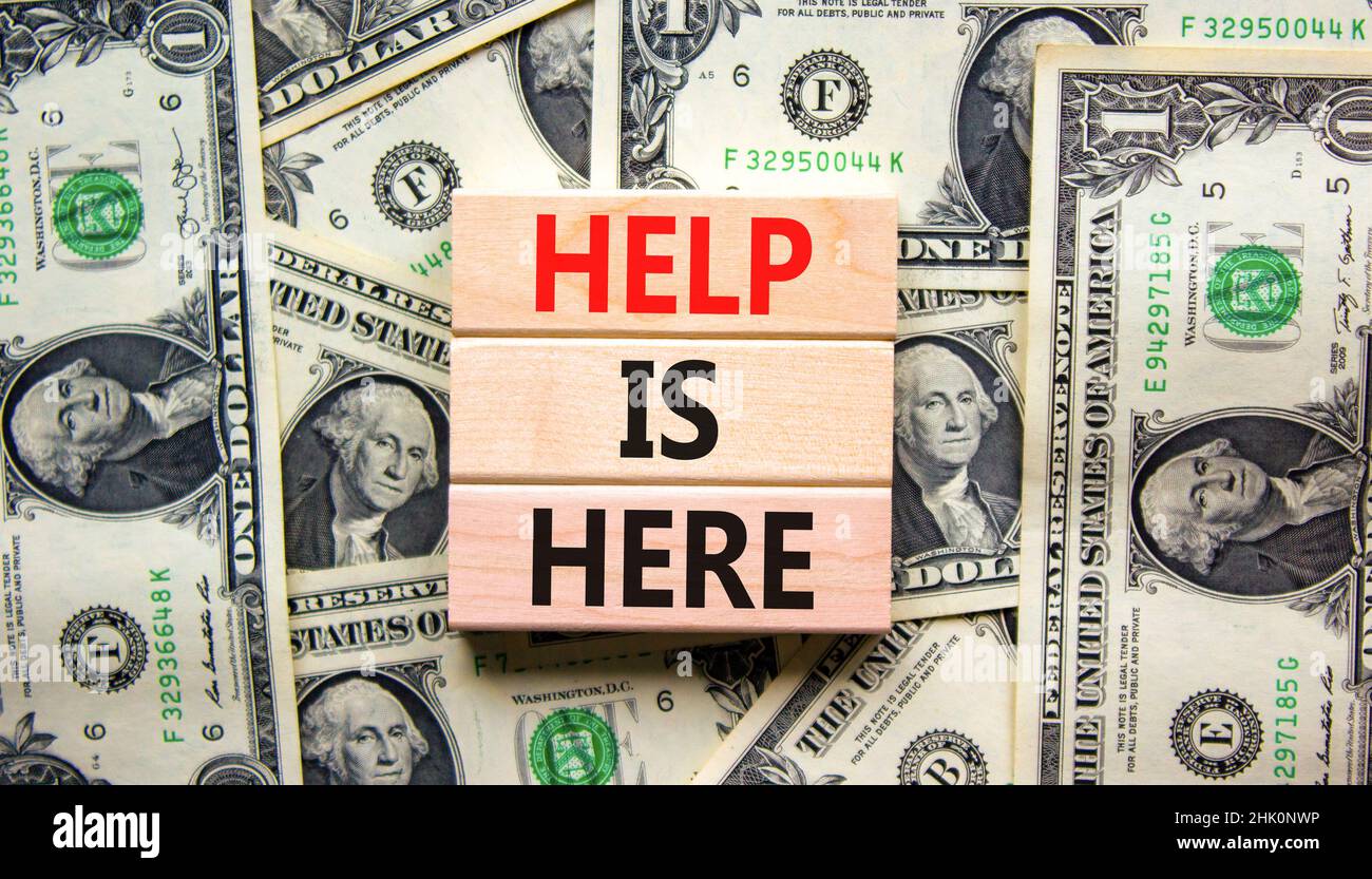 Help is here and support symbol. Concept words Help is here on wooden ...