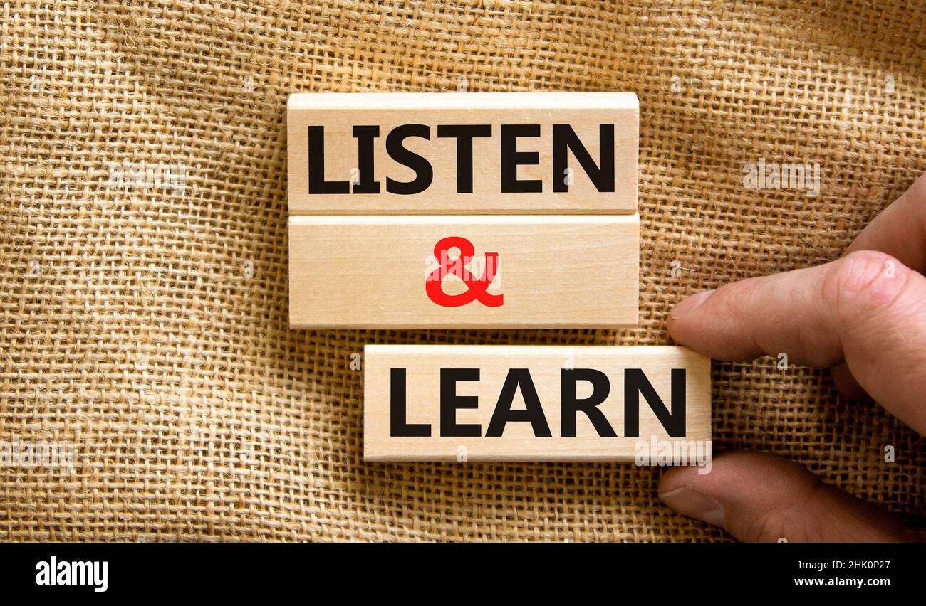 Listen and learn symbol. Concept words Listen and learn on wooden ...