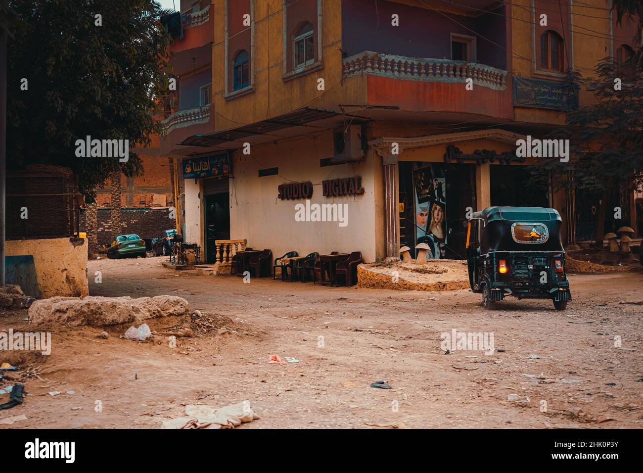 Cairo Egypt January 2022 Black tuk tuk driving into the sunset in cairo ...