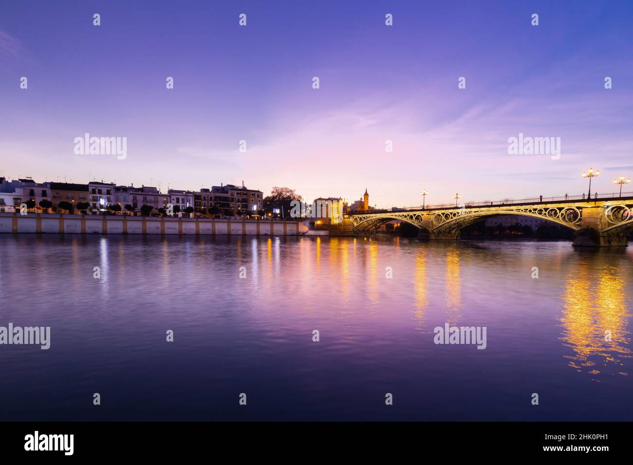 Sunset over the river Guadalquivir in downtown Seville with amazing ...