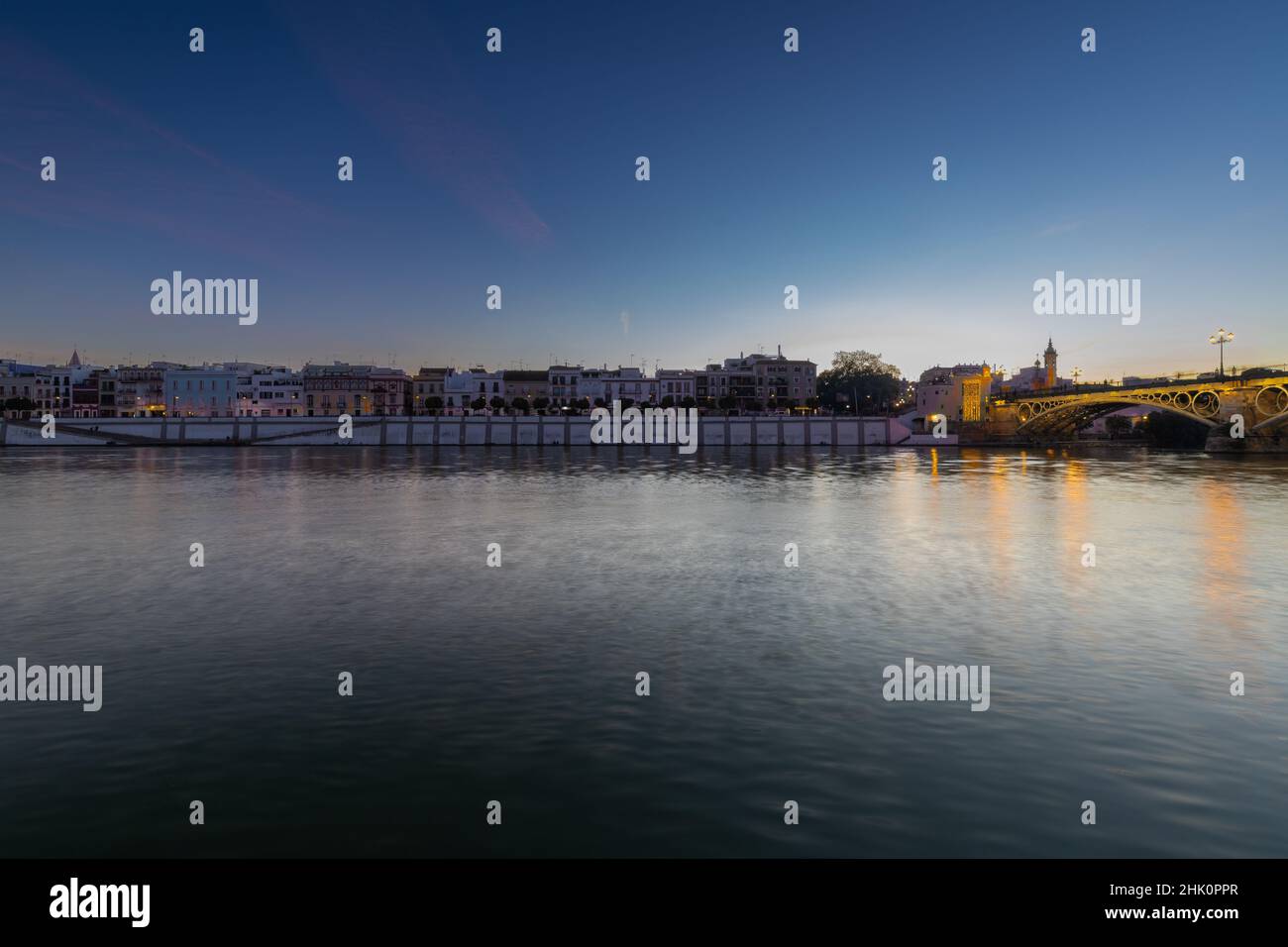 Sunset over the river Guadalquivir in downtown Seville with amazing ...