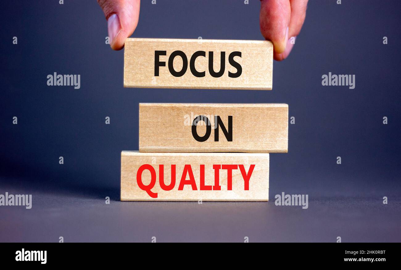 Focus on quality symbol. Concept words Focus on quality on blocks on ...