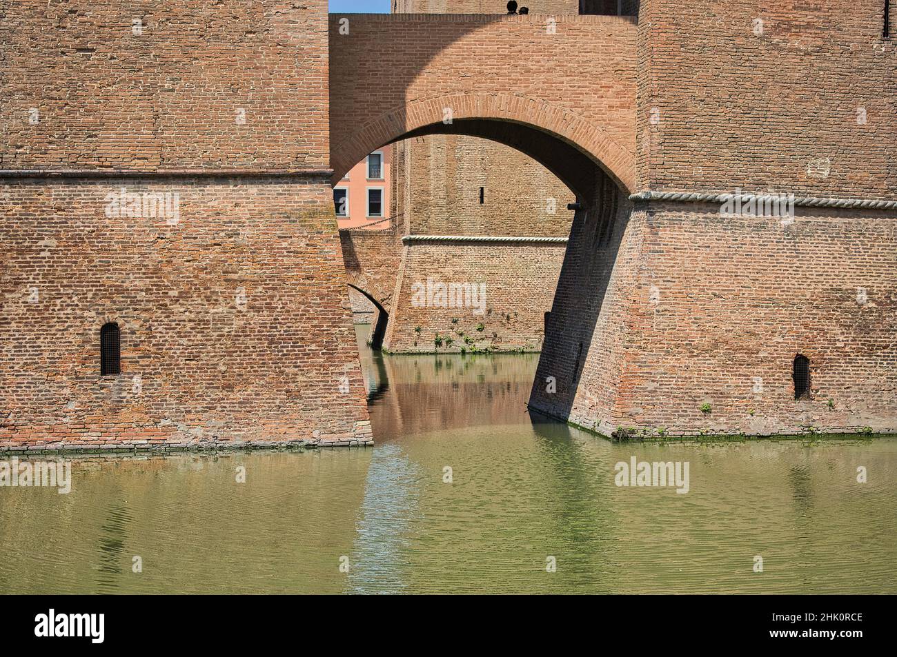 The moat of the famous medieval Este castle (Castello Estense) of ...