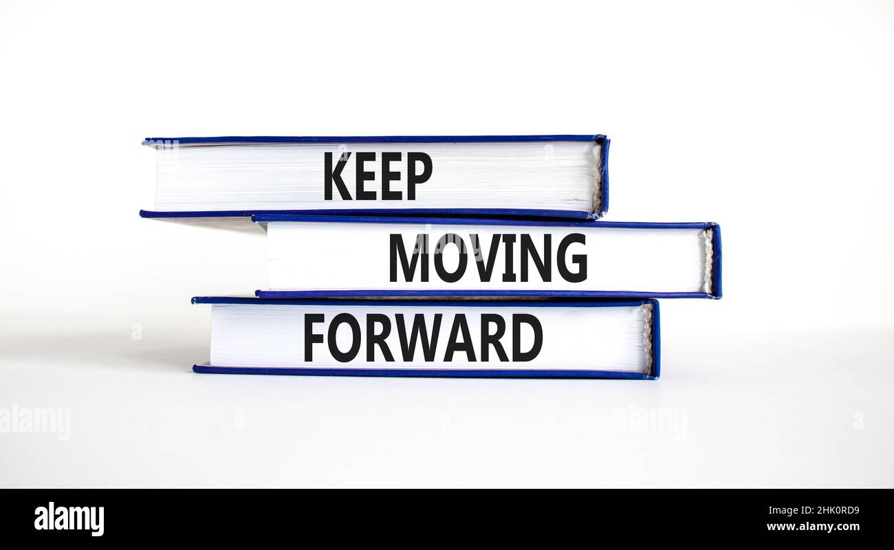 Keep moving forward symbol. Concept words Keep moving forward on books ...