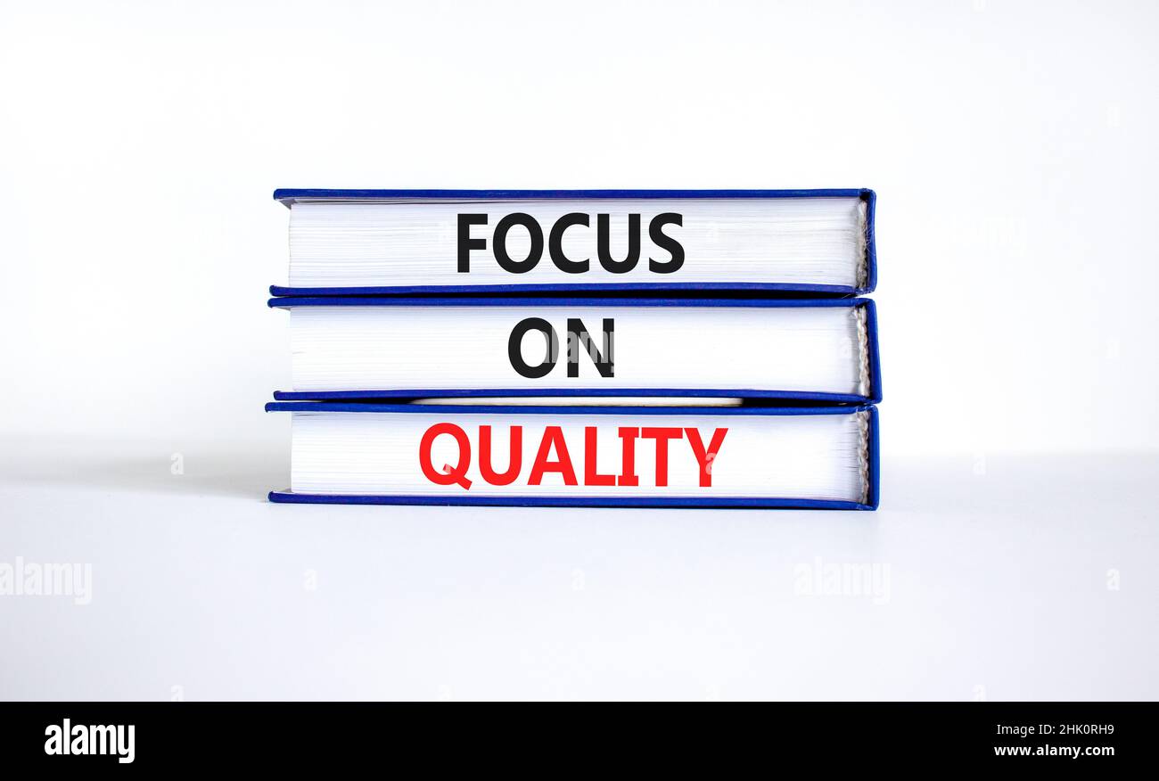Focus on quality symbol. Concept words Focus on quality on books on ...