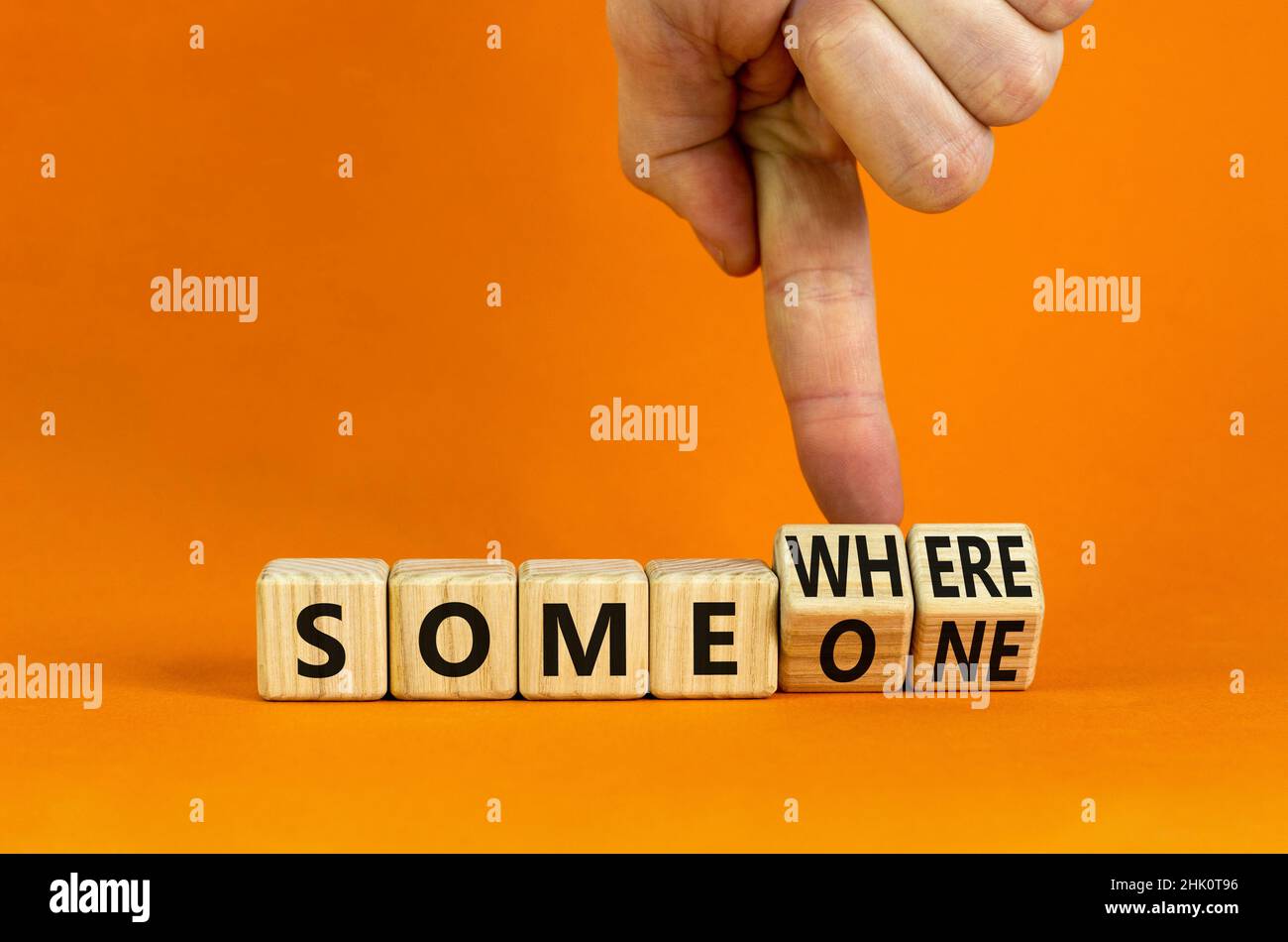 Someone somewhere symbol. Businessman turns wooden cubes and changes ...