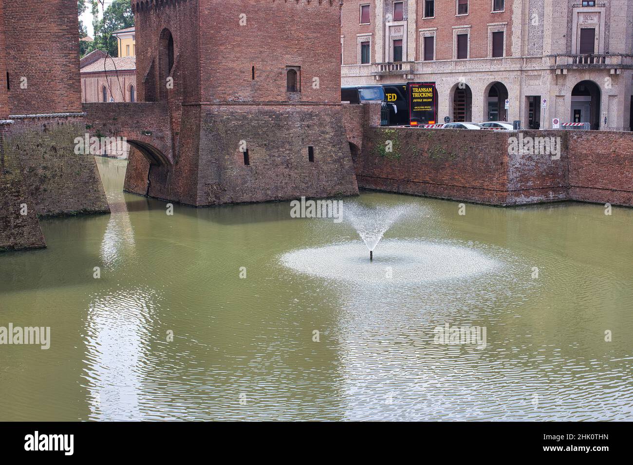 The moat of the famous medieval Este castle (Castello Estense) of ...