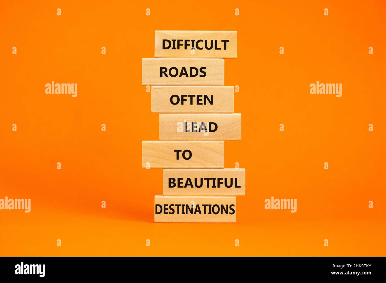 Motivational symbol. Blocks with words Difficult roads often lead to ...