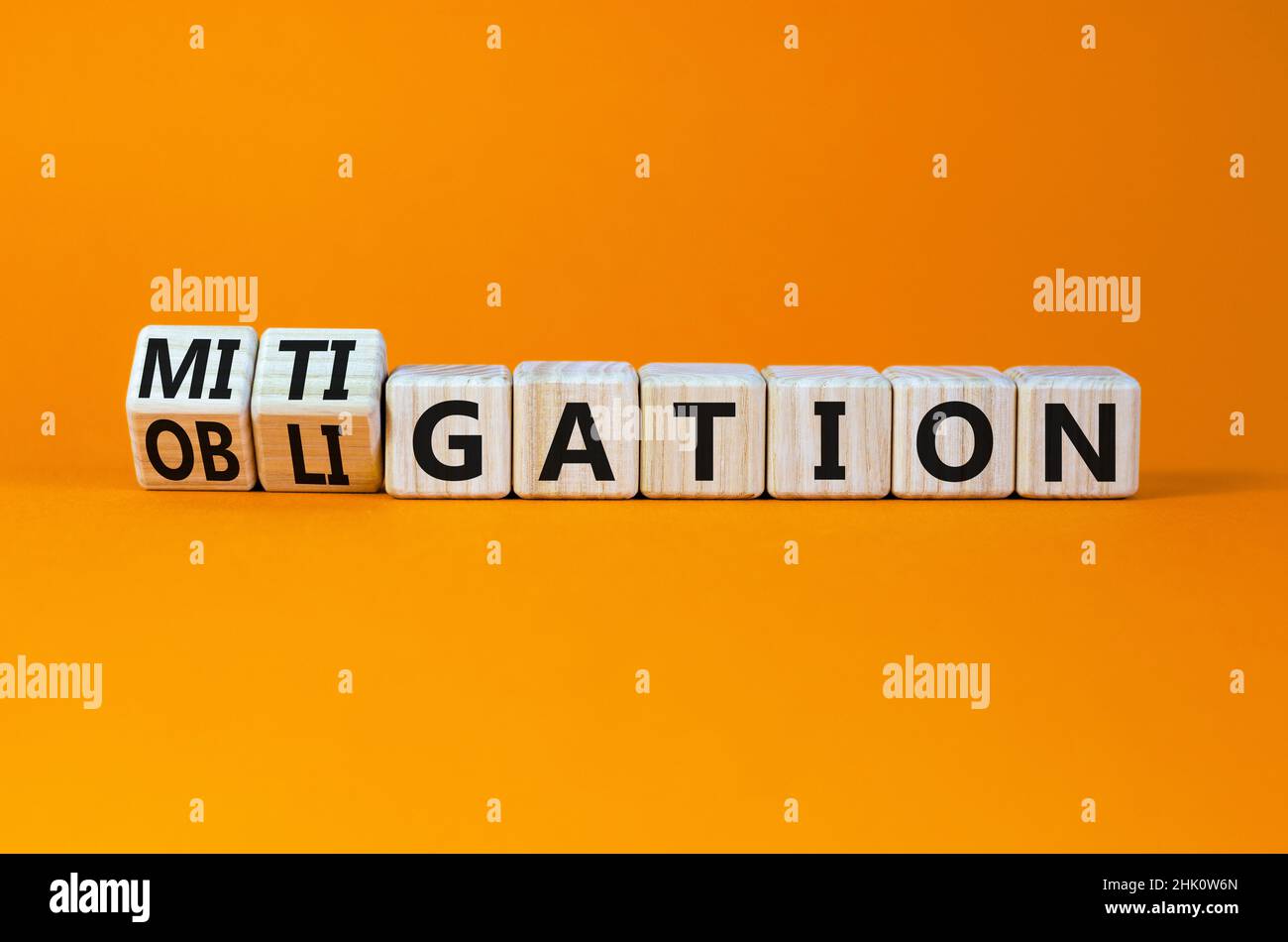 Obligation and mitigation symbol. Turned wooden cubes and changed the ...