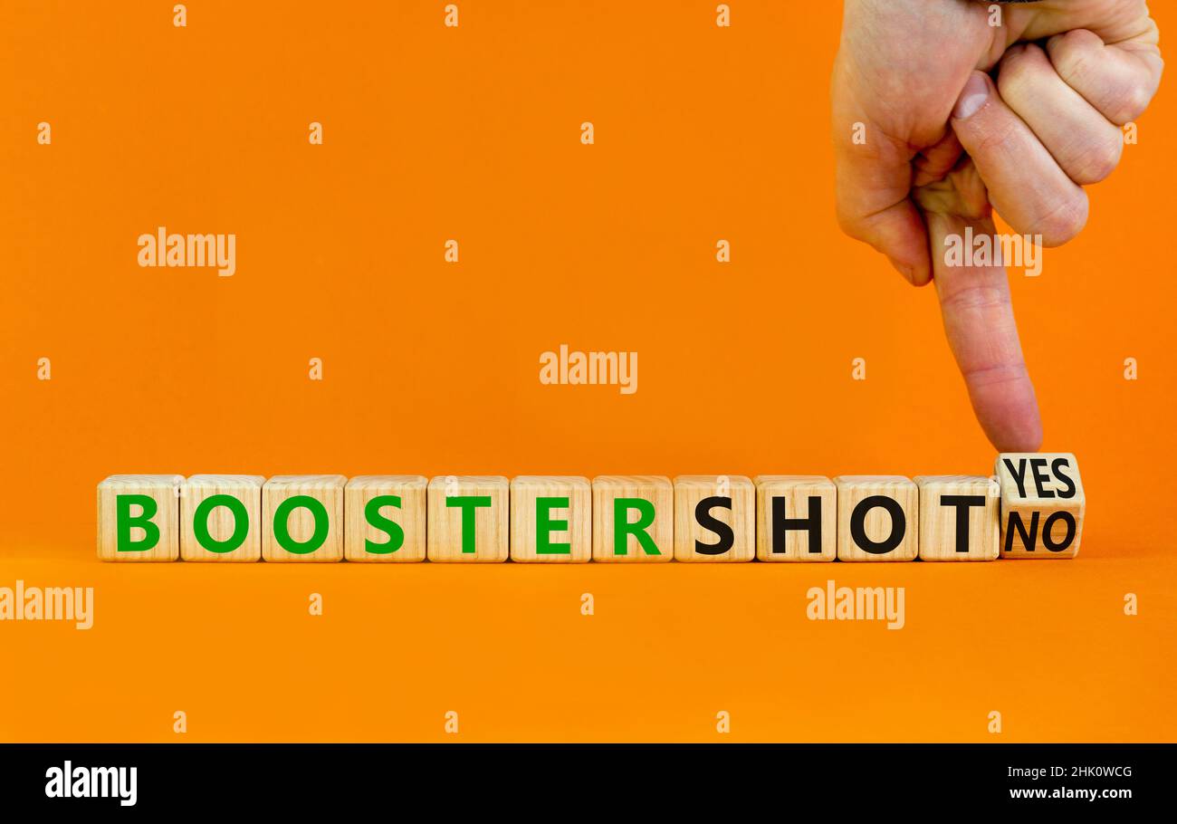 Covid-19 booster vaccine shot yes or no symbol. Doctor turns cubes and ...