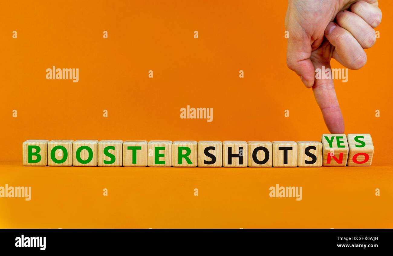Covid-19 booster vaccine shot yes or no symbol. Doctor turns cubes and ...