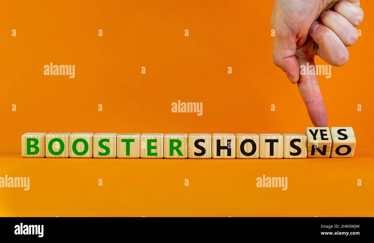 Covid-19 booster vaccine shot yes or no symbol. Doctor turns cubes and ...