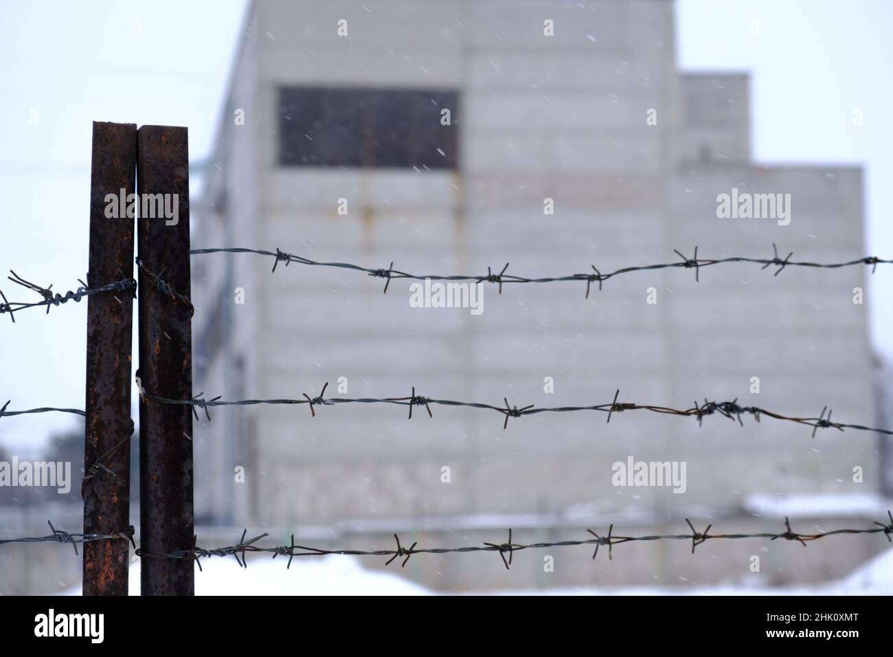 Barbed wire fencing to prevent entry into the protected area, rusty ...