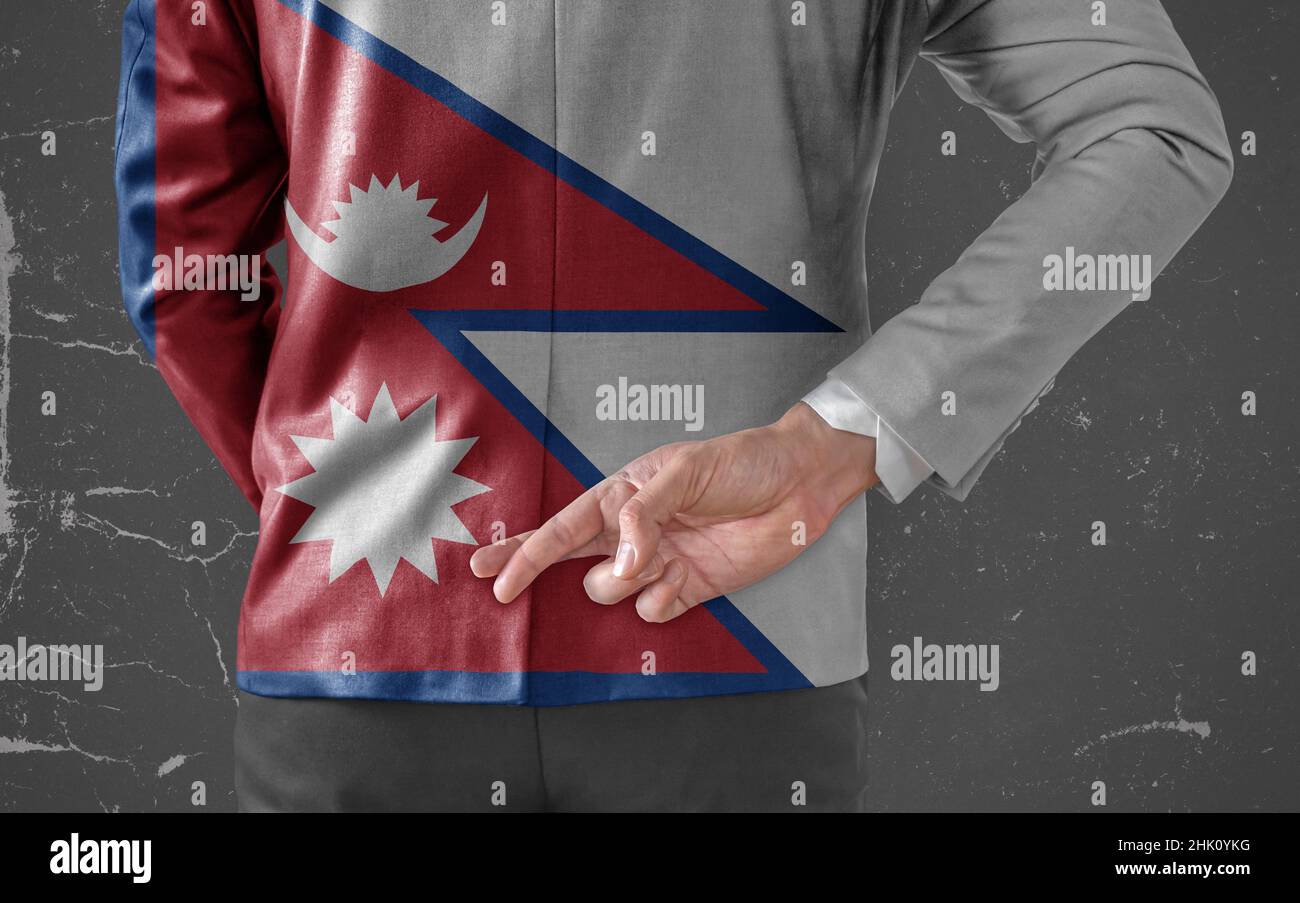 Businessman Jacket with Flag of Nepal with his fingers crossed behind ...