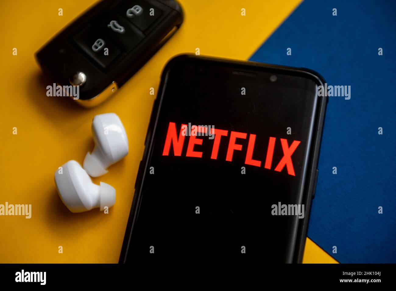 In this photo illustration a Netflix logo seen displayed on a smartphone. (Photo by Mateusz ...