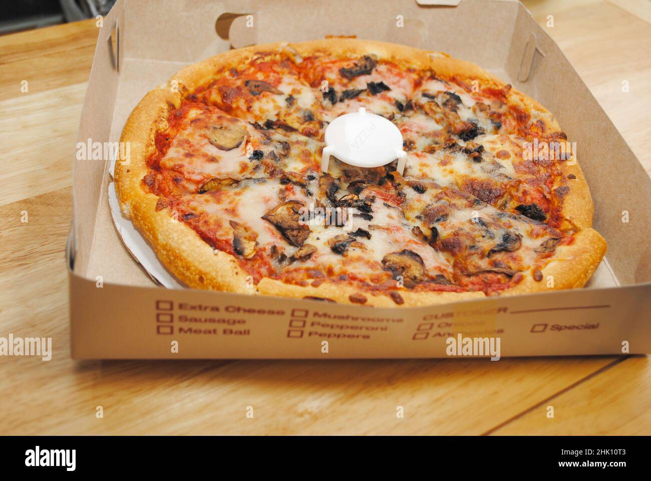 Mushroom and Cheesy Pizza in a Take-out box Stock Photo - Alamy