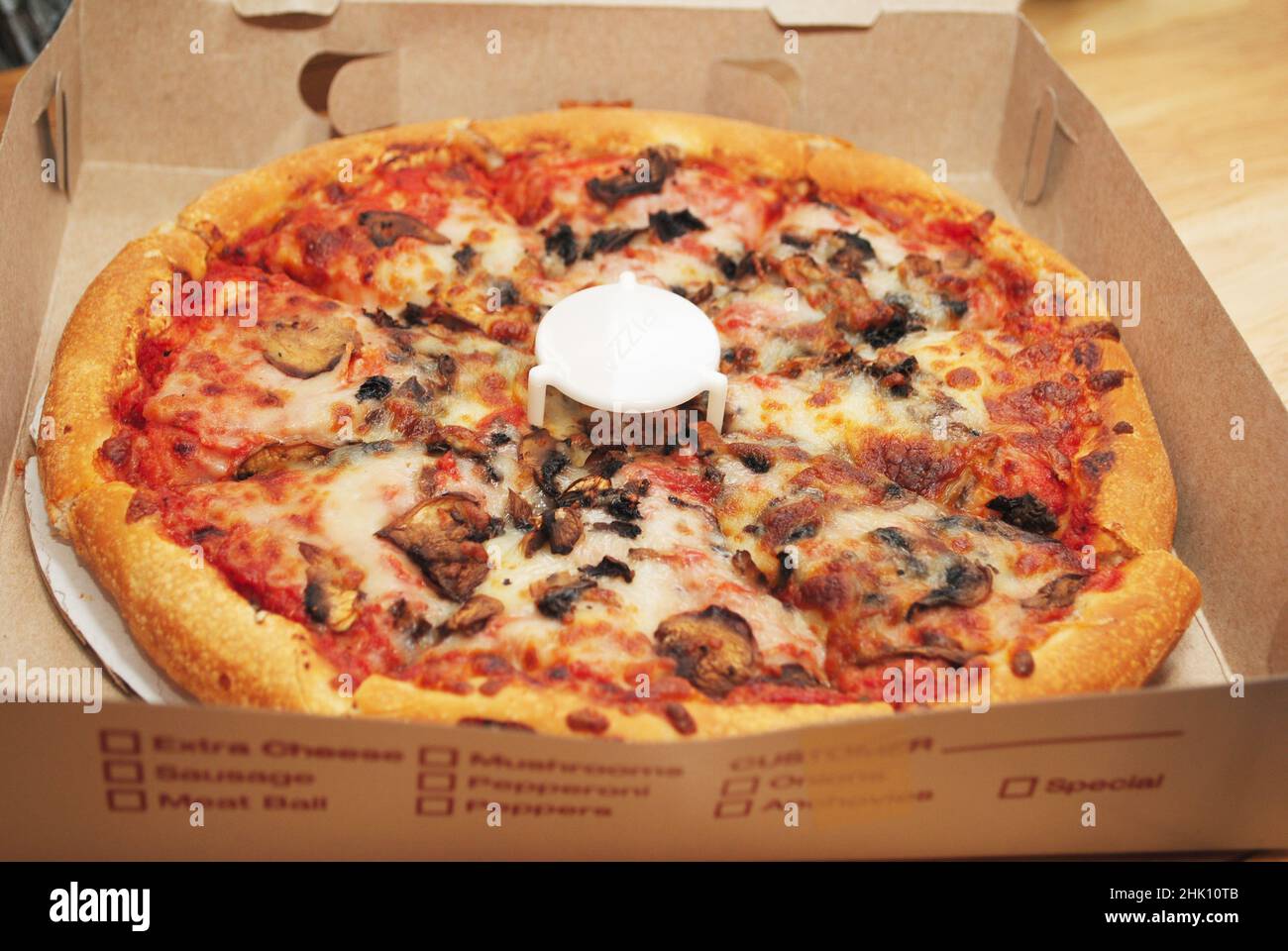 Mushroom and Cheesy Pizza in a Take-out box Stock Photo - Alamy