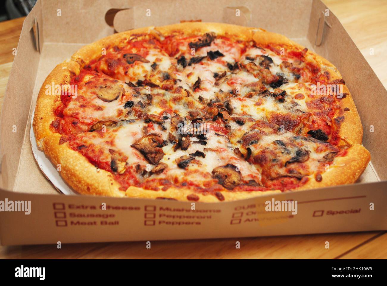 Mushroom and Cheesy Pizza in a Take-out box Stock Photo - Alamy