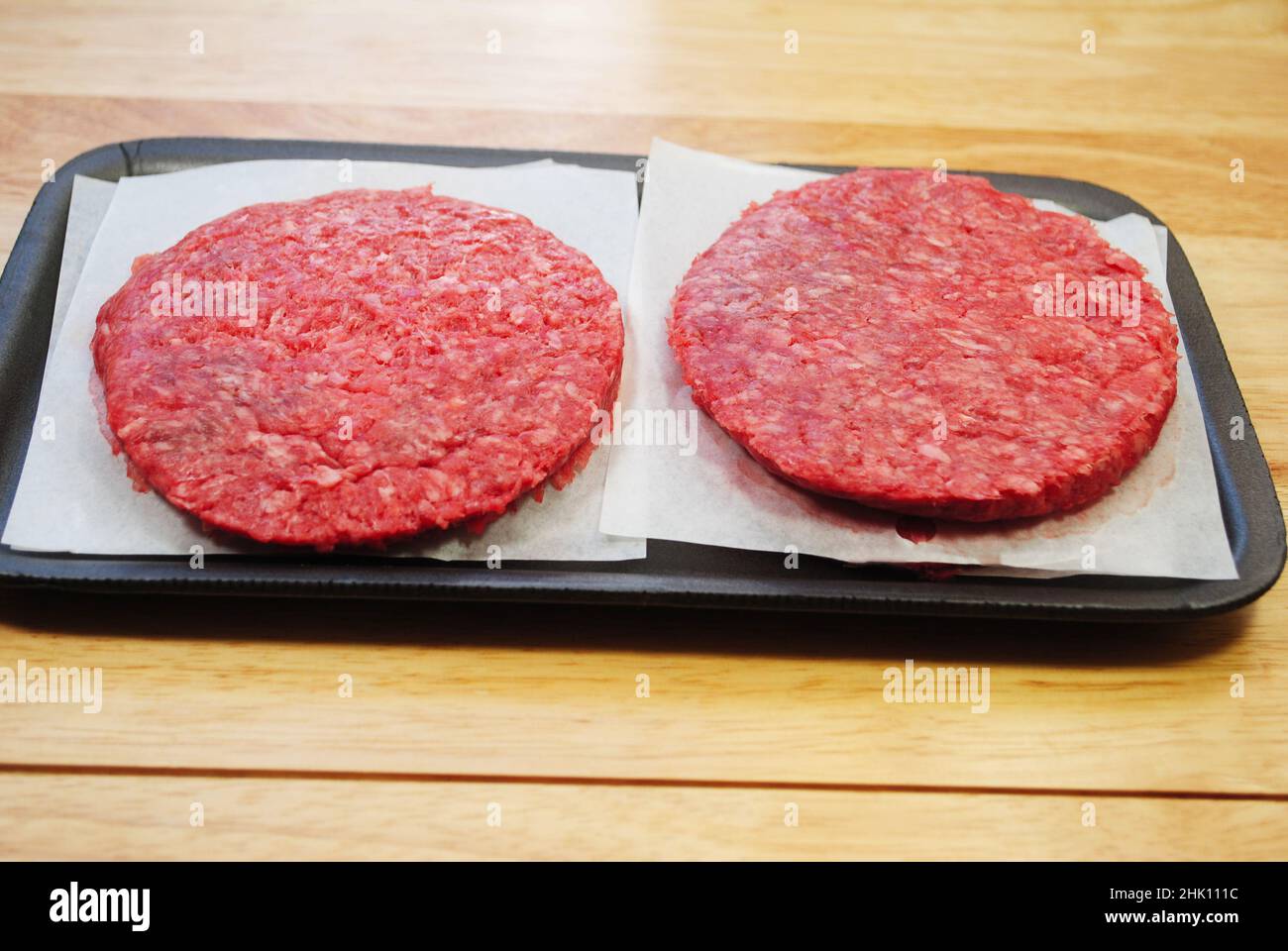 Fresh Raw Beef Hamburger Patties Stock Photo - Alamy