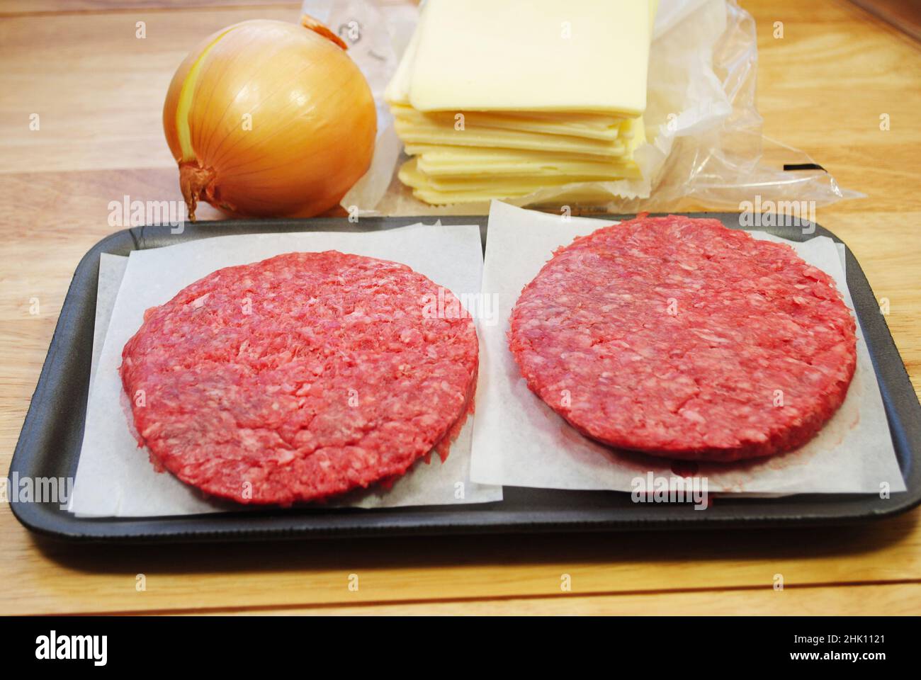 Fresh Cheeseburger Ingredients with Lean Raw Ground Beef Stock Photo ...