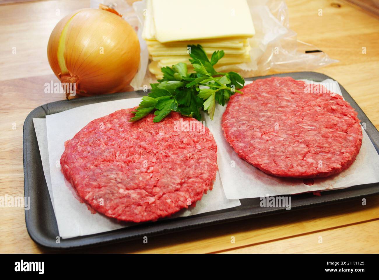 Fresh Cheeseburger Ingredients with Lean Raw Ground Beef Stock Photo ...