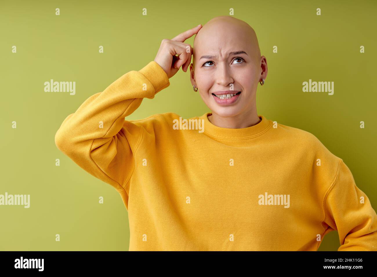 Face expressions and emotions. Thoughtful Caucasian bald female in ...