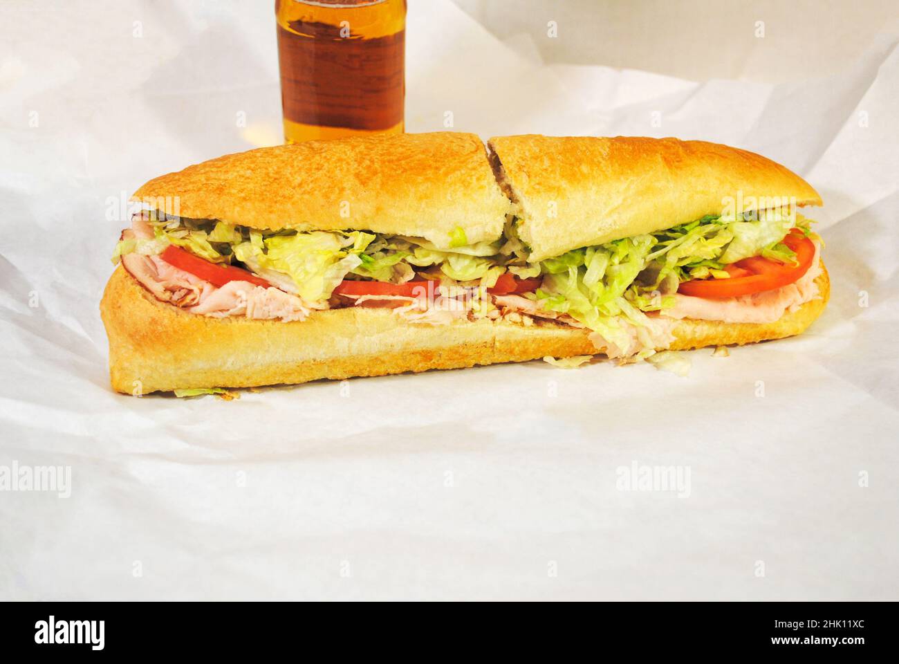 Large Turkey Hoagie Sub Sandwich with a Bottle of Beer Stock Photo - Alamy