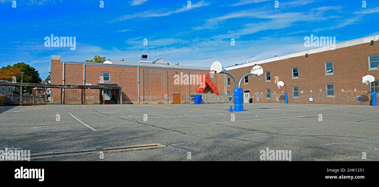 Empty school asphalt playground in Ridgefield, NJ,USA. With basketball ...