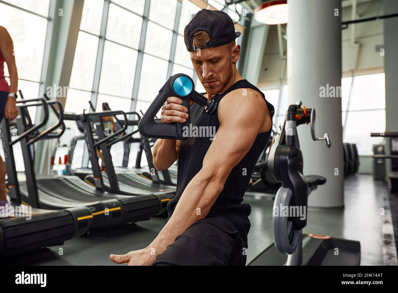 How to use a massage gun for recovery hi-res stock photography and ...